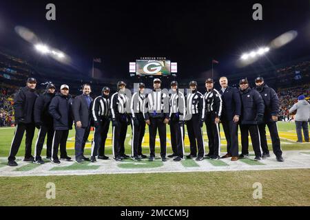 The officiating crew pose for a picture including line judge Rusty ...