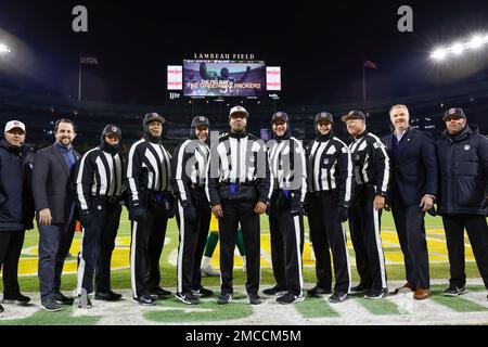 The officiating crew pose for a picture including line judge Rusty ...