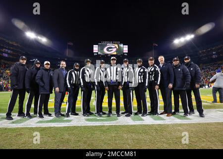 The officiating crew pose for a picture including line judge Rusty ...