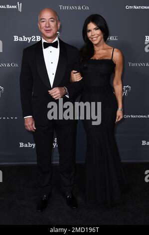 Jeff Bezos, left, and Lauren Sanchez pose for photographers upon their ...
