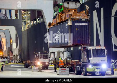 Five ship to shore cranes and gangs of longshoremen work the 1,199-foot ...