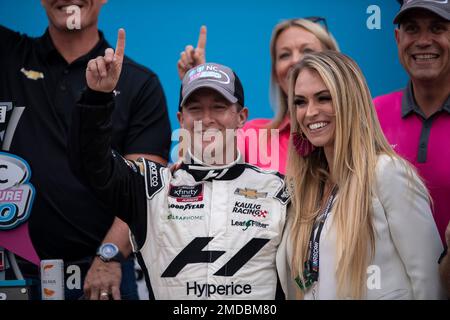 AJ Allmendinger (16) and his wife, Tara, look on prior to a NASCAR ...