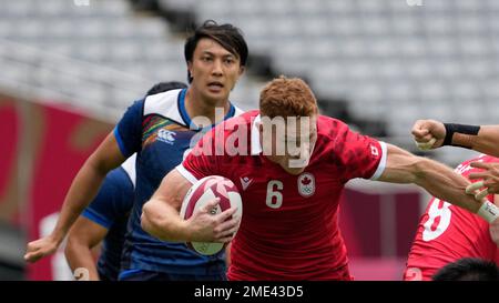 Canada's Connor Braid gets past Japan's Yoshikazu Fujita, right, and ...