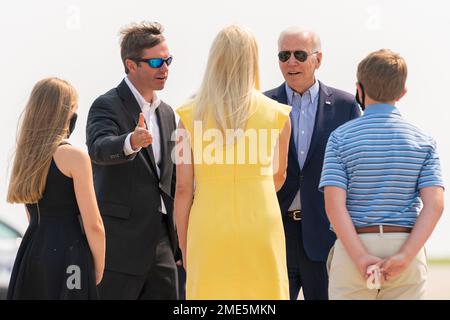 President Joe Biden is greeted by Kentucky Gov. Andy Beshear, second ...