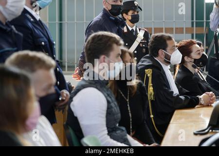 Second from left, Rosa Maria Calipari sits beside the coffin of her ...
