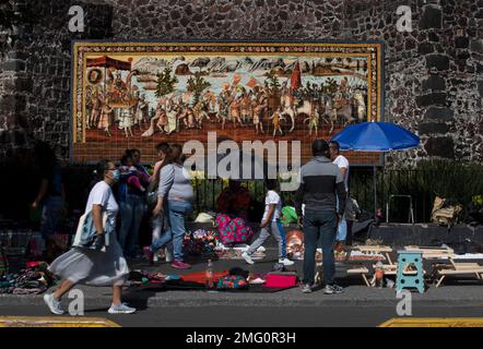 Locals walk past a mural dedicated to Spanish conquistador Hernan ...