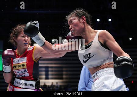 Japanese champion Miyo Yoshida, left, sends a left to Chinese ...