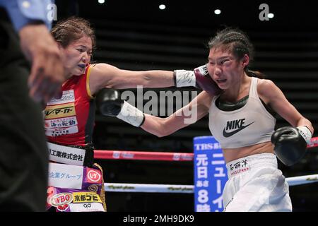 Japanese champion Miyo Yoshida, left, sends a left to Chinese ...