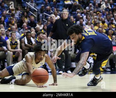 West Virginia's Jermaine Haley(10) is defended by Northern Colorado's ...