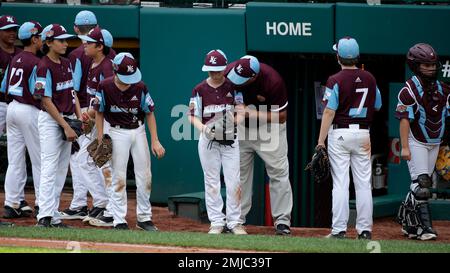 Barrington, Rhode Island coach Frank Fede, center talks with his ...