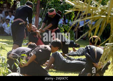 Cambodian students from Royal University of Fine Arts reenact torture ...