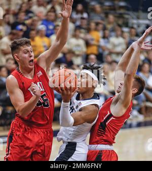 Pittsburgh's Au'Diese Toney, center, shoots over Troy's Jordon Varnado ...