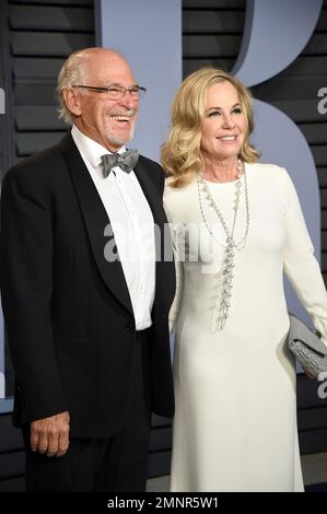 Jimmy Buffett, left, and Jane Slagsvol arrives at the Vanity Fair Oscar ...
