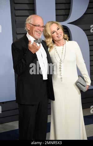 Jimmy Buffett, left, and Jane Slagsvol arrives at the Vanity Fair Oscar ...