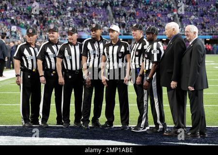 Officials pose before an NFL football game between the Los Angeles Rams ...