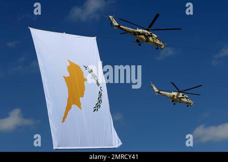 Military helicopters of Cypriot air forces fly over a military parade ...