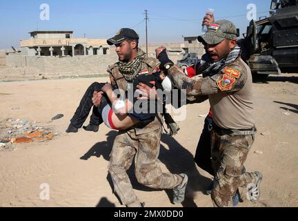 An Iraqi injured soldier who was wounded during the battle against the ...