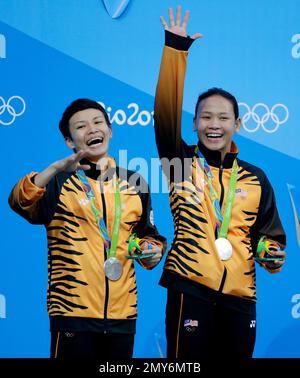 Malaysia's silver medalists Pandelela Rinong, right, and Cheong Jun ...