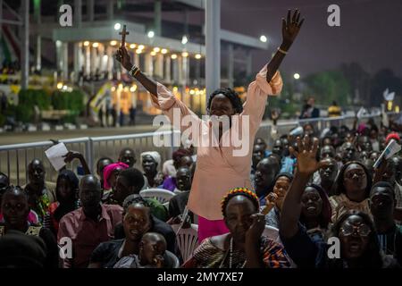 People sing as Pope Francis conducts an ecumenical prayer at the John ...