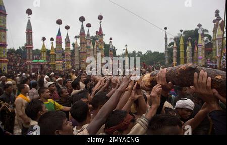 Indian Pnar or Jaintia tribesmen carry 'Rongs' or chariots and dance in ...