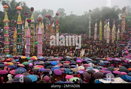 Indian Pnar or Jaintia tribesmen carry a 'Rong' or chariot and dance in ...
