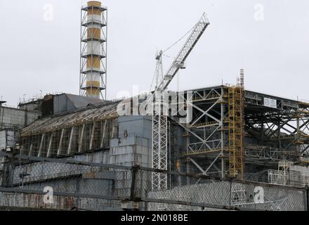 A chimney over the destroyed reactor at the Chernobyl nuclear power ...