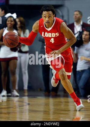 New Mexico guard Elijah Brown goes up for a basket as New Mexico State ...