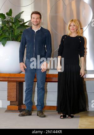 Actors, from left, Sienna Miller, and Robert Pattinson, pose for ...