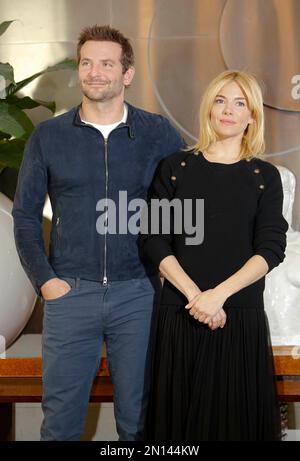 Actors, from left, Sienna Miller, and Robert Pattinson, pose for ...