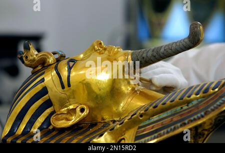 German restorer Christian Eckmann examines the beard of the golden mask ...