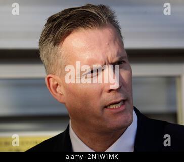 Pierce County Prosecutor Mark Lindquist walks with his daughter Slone, 6, as they visit a ...