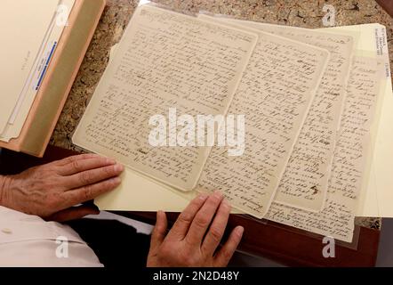Bob Hirst, general editor of the Mark Twain Project, looks through a ...