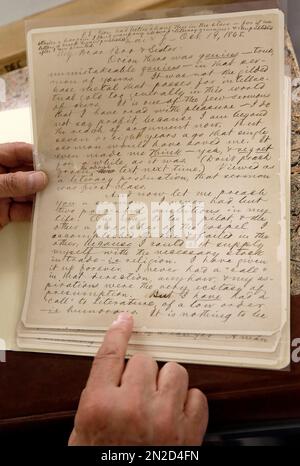 Bob Hirst, general editor of the Mark Twain Project, looks through a ...