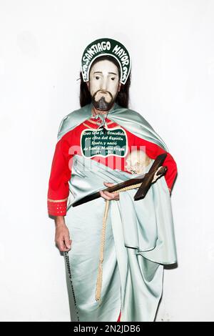 A penitent poses for a picture dressed with typical Apostle dress ...