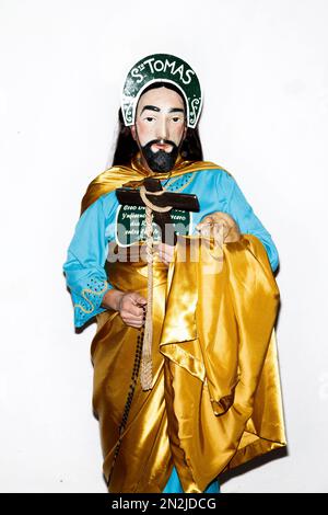 A penitent poses for a picture dressed with typical Apostle dress ...