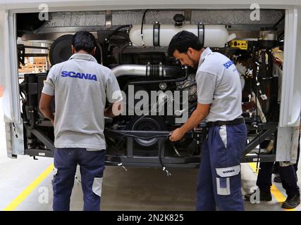 Indian employees of Scania work at the company's new manufacturing ...