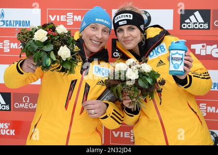 Second placed, from left, Germany's Vanessa Hinz, Janina Hettich ...