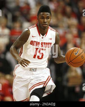 Ohio State's Kam Williams (15) drives to the basket between Nebraska's ...