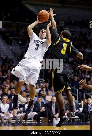 Butler guard Alex Barlow, left, heads up court after stealing the ball ...