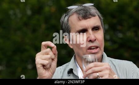 Eric Betzig from the U.S. talks to journalists in front of the ...