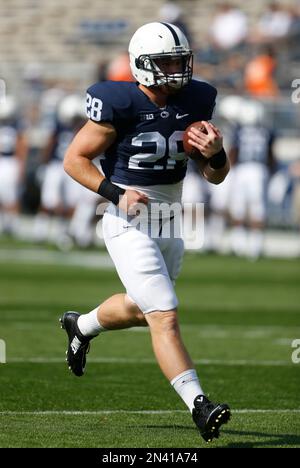 Penn State running back Zach Zwinak, left, runs a drill during the ...
