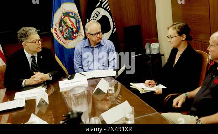 Congressman Tim Walz, D-Minn., left, talks with Melissa Houghtaling ...