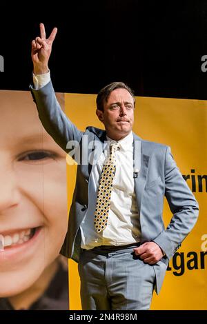 Leader of the NVA party Bart De Wever leaves the booth after casting ...