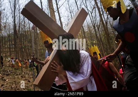 Indian Christian devotees enact the crucifixion of Jesus Christ to mark ...