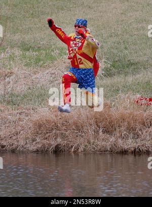 Kansas City Chiefs fan Ty Rowton, known as XFactor, exits the water ...