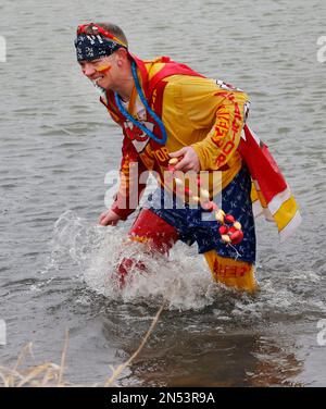 Kansas City Chiefs fan Ty Rowton, known as XFactor, exits the water ...