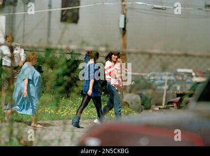 Mary Beth Whitehead holds her daughter Melissa Stern during a weekly visit at a youth center in ...