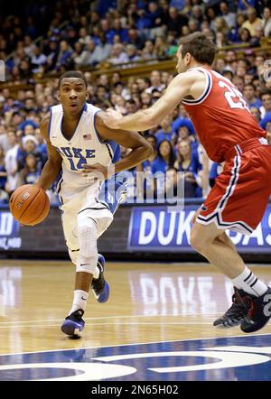 Duke's Rasheed Sulaimon (14) dribbles around Syracuse's Tyler Ennis (11 ...