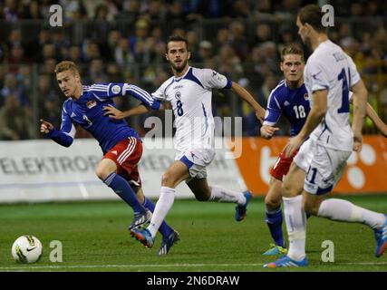 Bosnia's Edin Dzeko, second left, Miralem Pjanic, right, and Amer Gojak ...