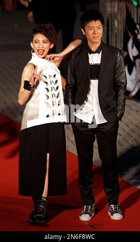 Malaysian singer Penny Tai, left and Singapore singer JJ Lin pose with ...